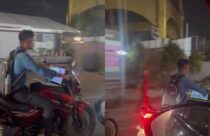 Watch: Man rides with laptop on bike's fuel tank in Telangana